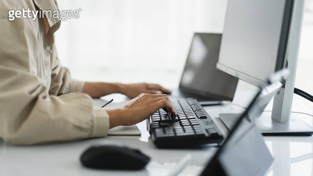 Developer programmer typing code on keyboard for programming to developing web and application ...