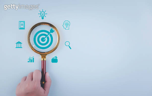 Magnifying glass focus with target objectives with business icons ...