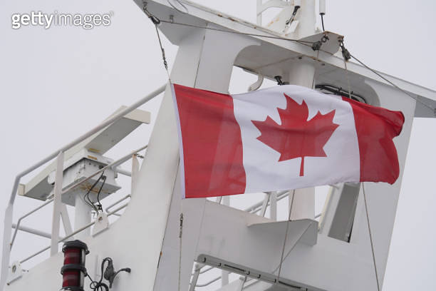 The Canadian national flag waving on top of a BC Ferries vessel in ...