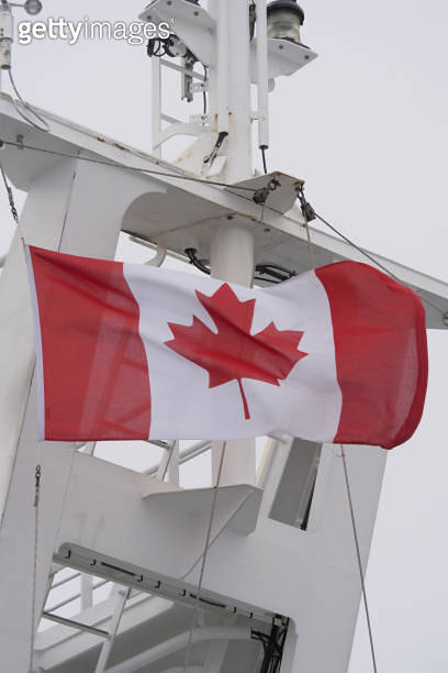 The Canadian national flag waving on top of a BC Ferries vessel in ...