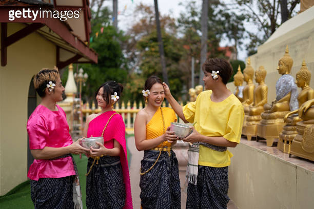Young Thai people dress in traditional Thai costumes and play in the ...
