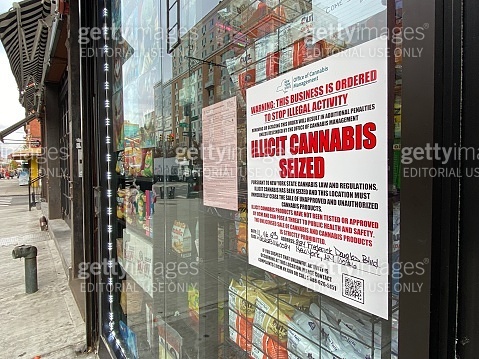 "Illicit Cannabis Seized" sign on the facade of a small store at 2124 ...