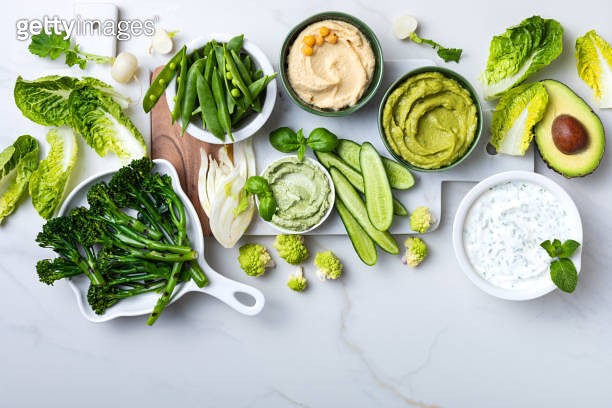 Green spring vegetable appetizer platter with dips. Healthy crudites ...