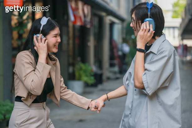 Asian couples playfully bond, sharing affectionate gazes, laughter, and ...