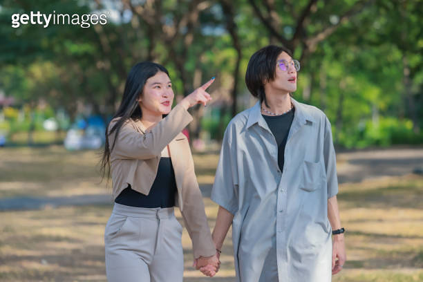 Asian couples playfully bond, sharing affectionate gazes, laughter, and ...