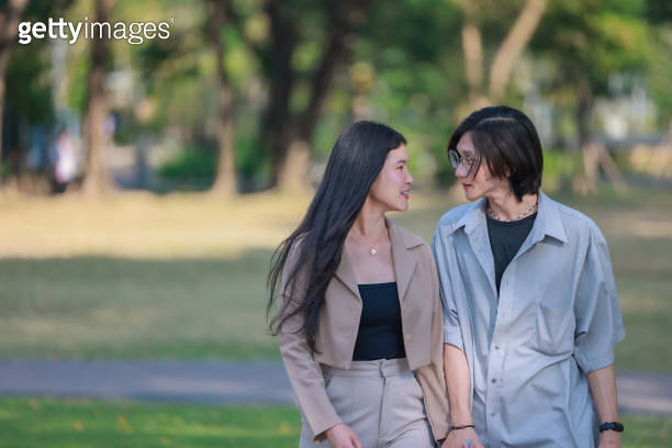 Asian couples playfully bond, sharing affectionate gazes, laughter, and ...