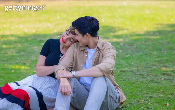 LGBT couple sharing romantic love and care in public, celebrating ...