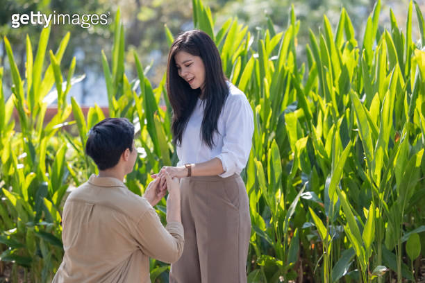 Lesbian couple sharing romantic love and care in public, celebrating ...