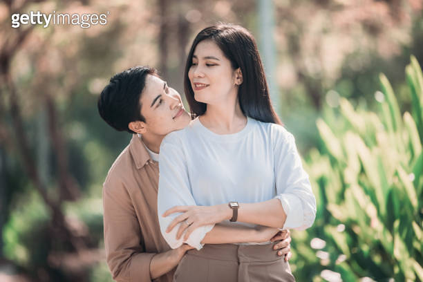 Lesbian couple sharing romantic love and care in public, celebrating ...