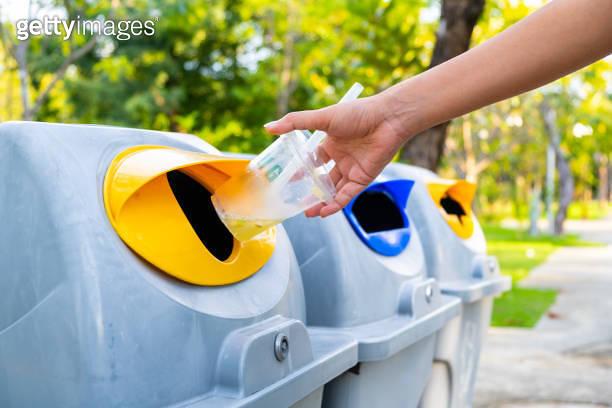 Please throw plastic bottles in the bin. Man littering the bins by ...