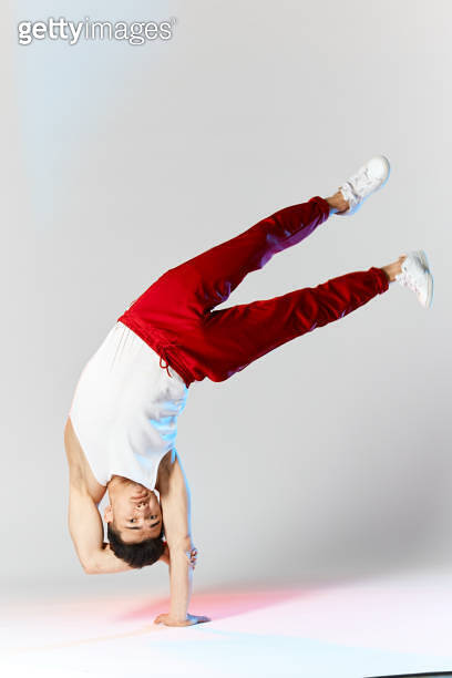 Handstand of Korean breakdancer performs breakdance freeze upside down ...
