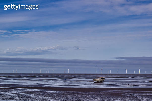 Small pleasure craft in Liverpool Bay at low tide, Meols, Wirral ...