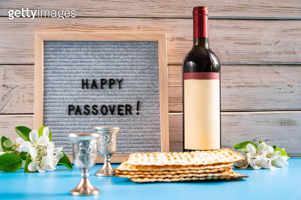 Celebrating spring holiday Passover. Bottle of wine and traditional ...