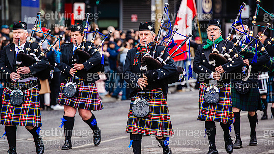 Marching band with traditional British uniform parading in the Saint ...