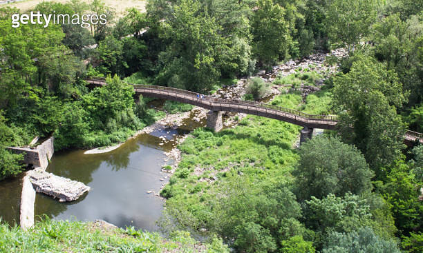 View of the bridge and river on a summer day. Top view. Castellfollit ...
