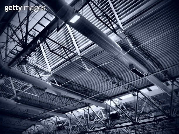 The roof of a hangar, a production hall or a sports hall. Metal ...