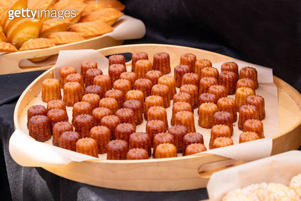 Mini Caneles de Bordeaux, many canele cakes, small french dessert ...