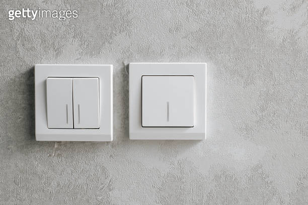 Close-up of two modern light switches, front view (1924121343) - 게티이미지뱅크