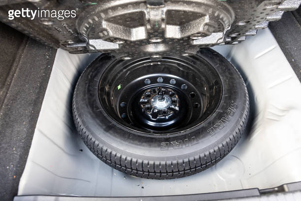 Temporary spare tire in the car boot for emergency use (2037845367 ...