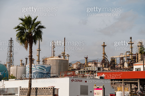 Modern coloraful incinerator in a tropical country. Refinery factory ...