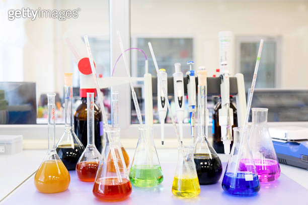 Chemical analysis, pharmacology and laboratory concept. Flasks with ...