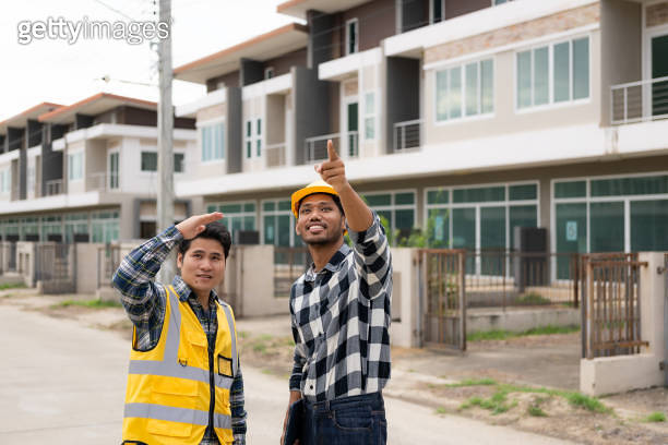 Contractor, male construction worker inspecting construction site ...