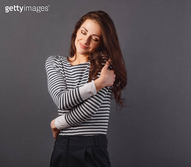 Happy makeup business woman hugging herself with natural emotional ...