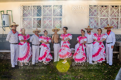 young people doing Mexican folk dance with colorful costumes, in Monte ...