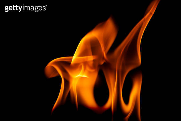Hot flames on a black background. Beautiful flame of fire in the dark ...