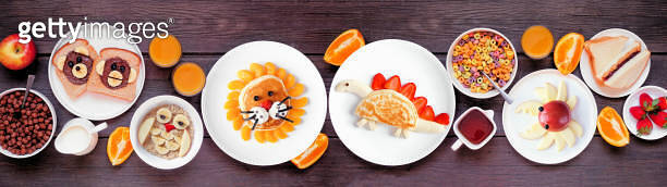 Child theme breakfast table scene with assorted animal themed foods ...