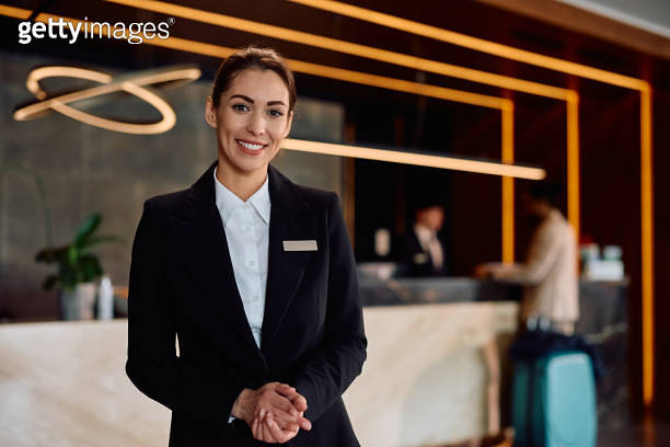 Portrait of smiling female hotel manager looking at camera. 이미지 ...