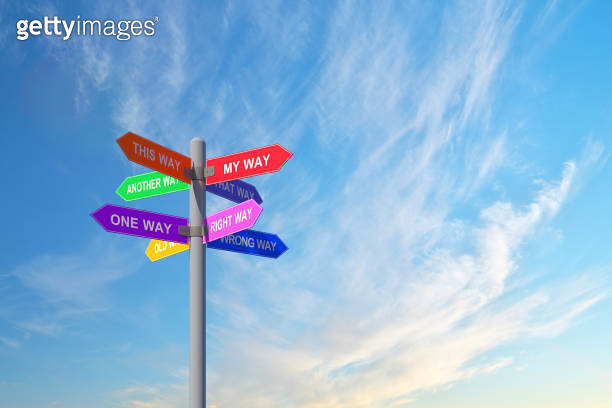 Directional Signboards In Different Colors Facing Different Directions