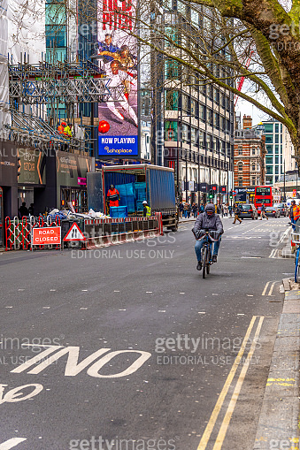 Central London street with a building under construction with ...