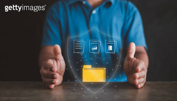 Document security concept, Businessman hands holding shield for protect ...