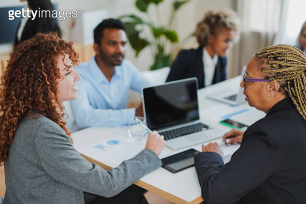Multiracial business people working together inside modern office ...
