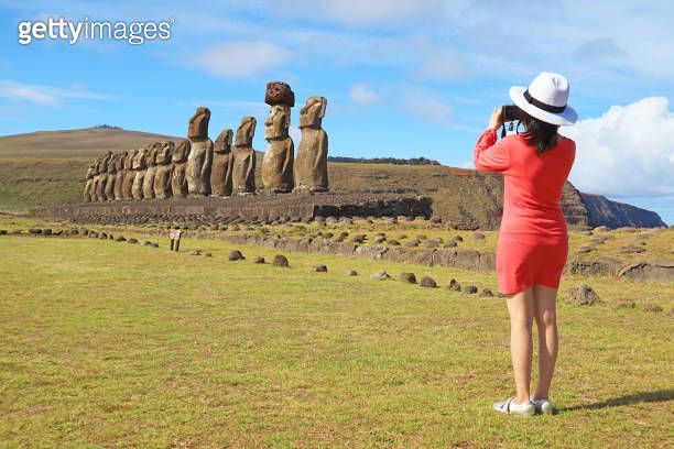 Female Visitor Shooting Picture of the Iconic Fifteen Moai Statues of ...