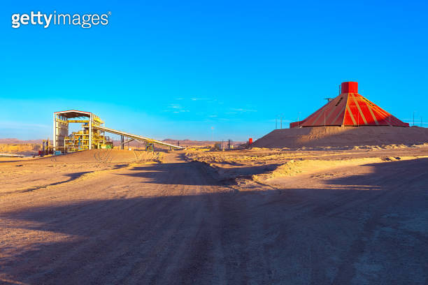 Conveyor belt and stockpile under a dome at an open-pit copper mine in ...