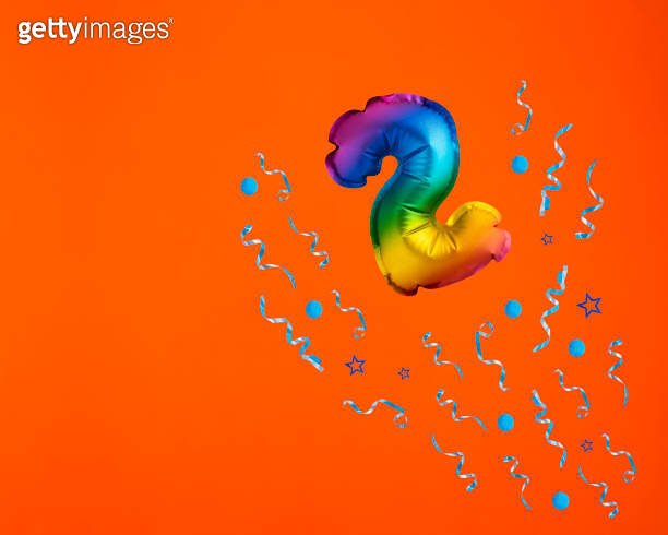 Confetti explosion with number 2 balloon - Celebration on orange ...