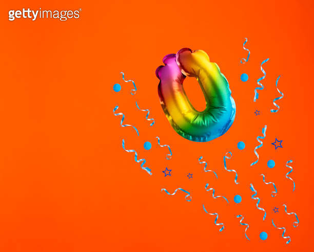 Confetti explosion with number 0 balloon - Celebration on orange ...