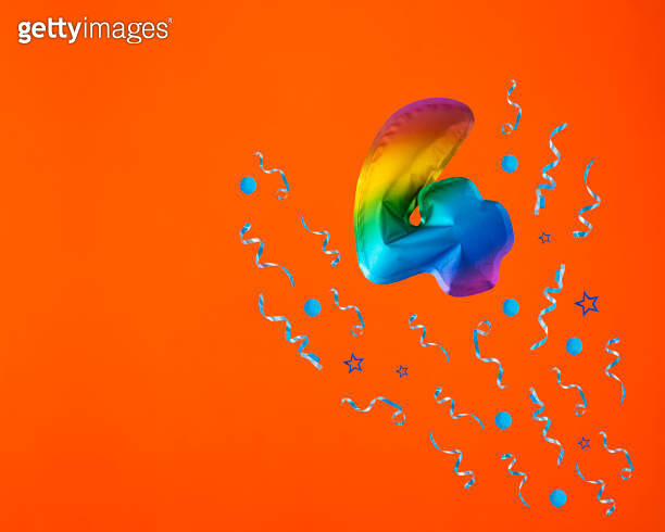 Confetti explosion with number 4 balloon - Celebration on orange ...