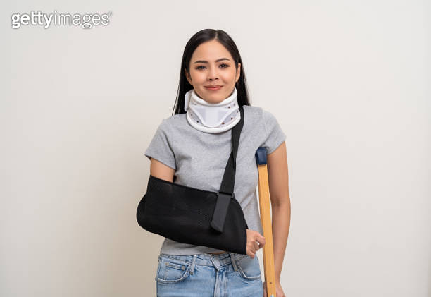 Happy young asian woman broken arm and leg on isolated. Woman put on ...