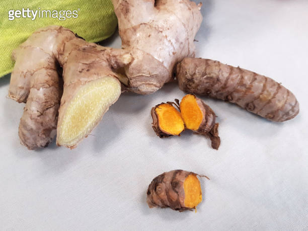 Aerial view of fresh split natural ginger and turmeric pieces. Ginger ...