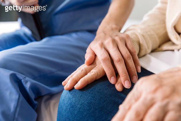 Close-up senior Asian woman hand with her caregiver helping hands, Caregiver visit at home. Home ...