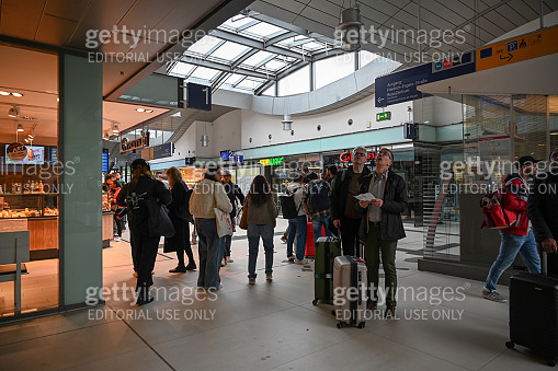 Passengers walk through the station passage to the trains at Potsdam ...