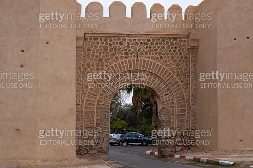 old fortress wall with gate, Authentic details traditional Moroccan ...