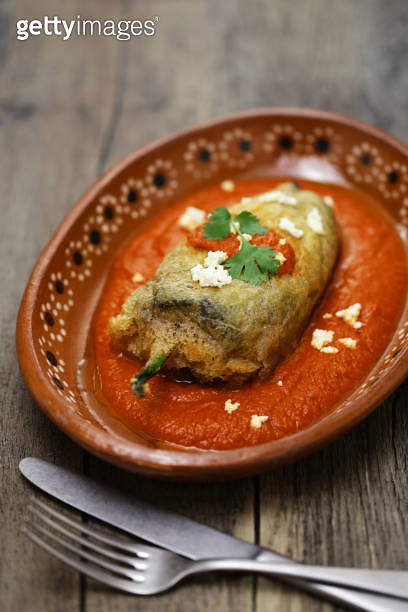 chile relleno (fried poblano pepper stuffed with minced meat and coated ...