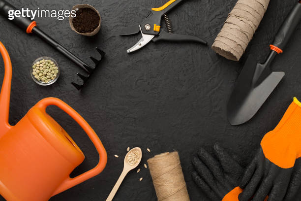 Orange gardening tools on conctere background, top view 이미지 (2107654415 ...