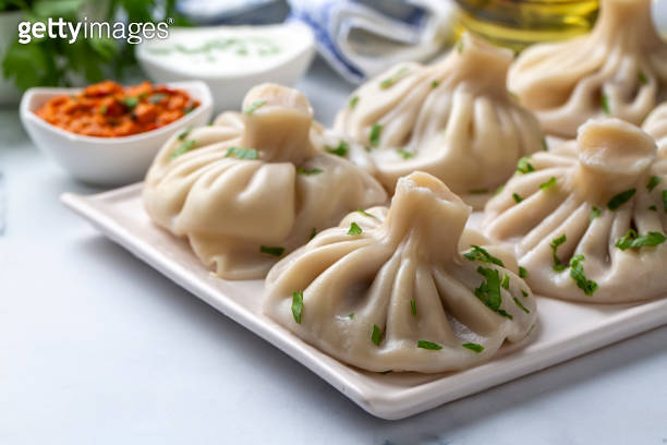 Traditional Georgian dish khinkali - Hinkali - Boiled khinkali with ...