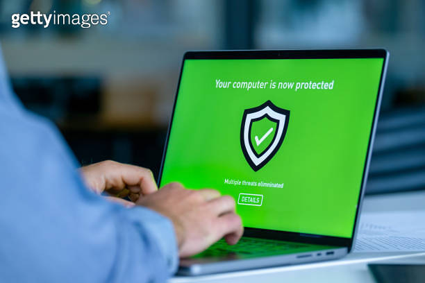 Businessman using antivirus software on a laptop. 이미지 (2161243544) - 게티 ...