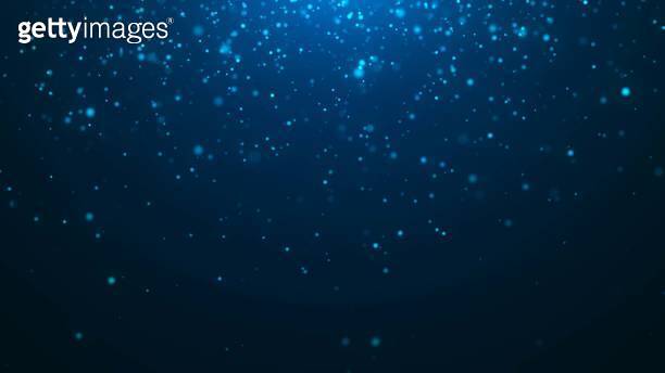 Dust particles with bokeh effect on dark background. Abstract magic ...